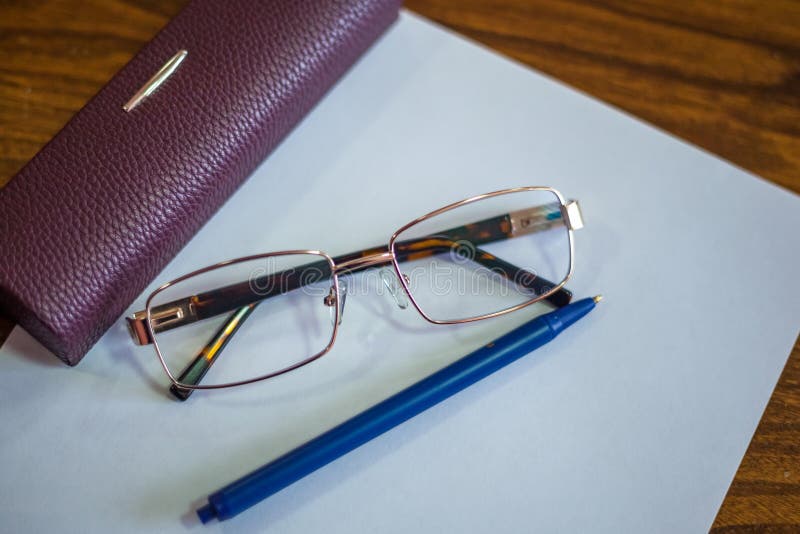 Ballpoint Pen on a Sheet and Reading Glasses with Box Stock Image ...