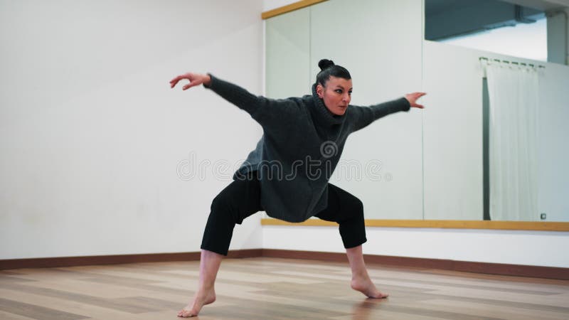 In the Ballroom a Lonely Woman Practices Postural Dance for the Back ...