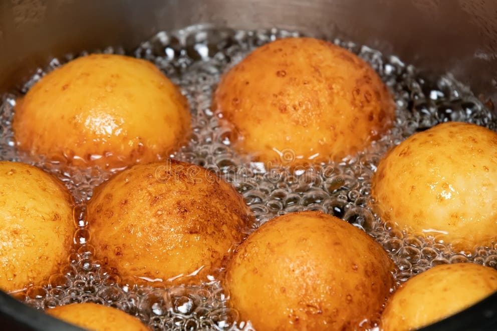 Balls of Dough in Hot Boiling Oil, Deep Fried Stock Photo - Image of ...