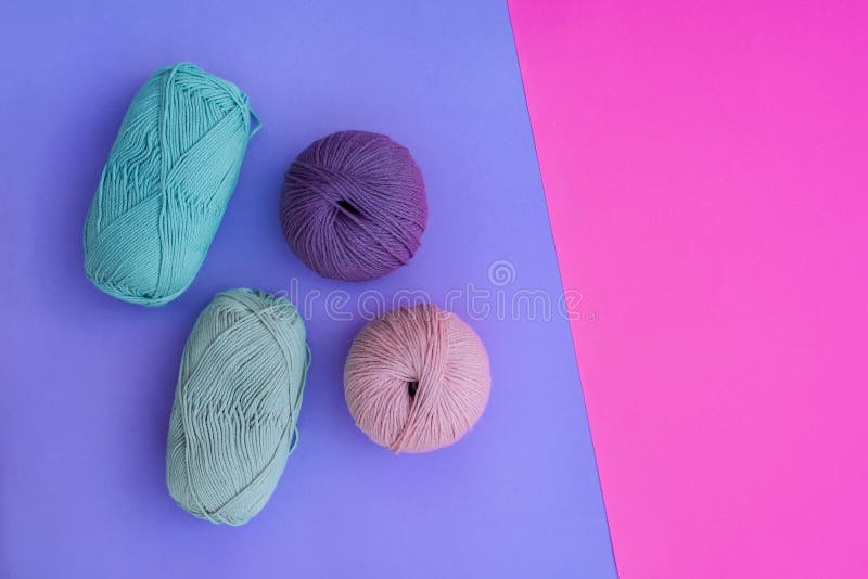 Balls of Yarn - Pink, Violet, Olive and Blue on Violet Surface a Stock ...