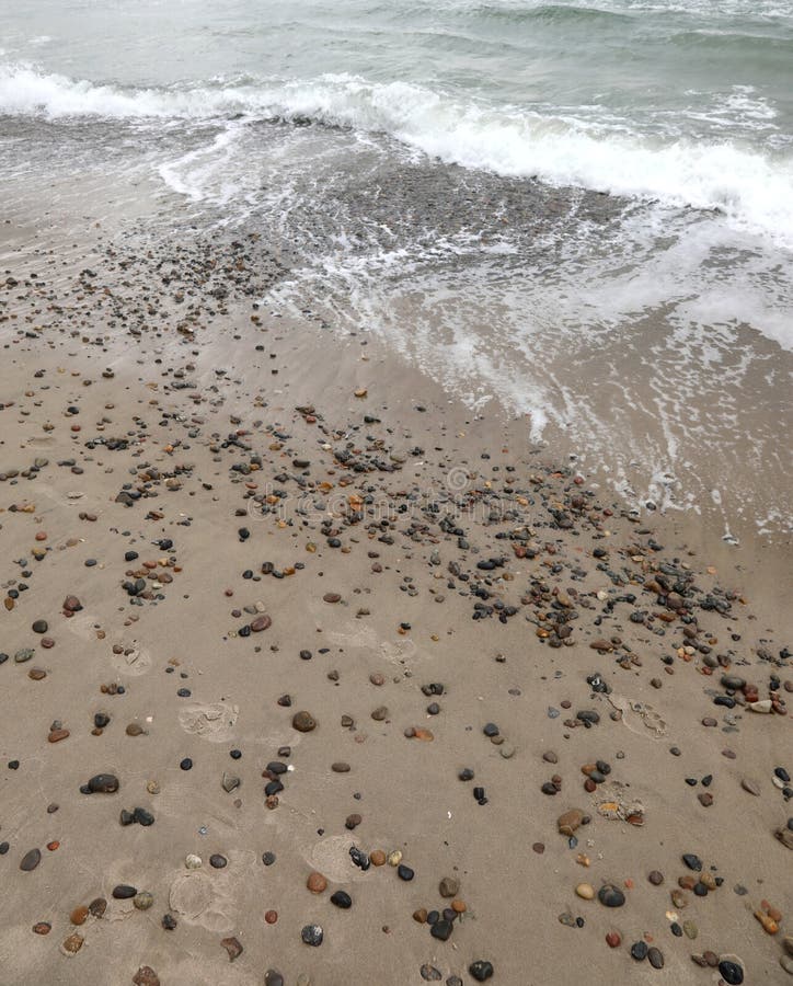 Sea Shore with Rocks Being Buried by Sand and Wind Stock Image - Image ...