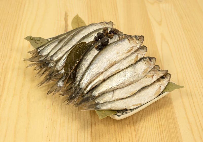 Baltic Sprat Spicy Salted Stands on a Pine Table Stock Image - Image of ...
