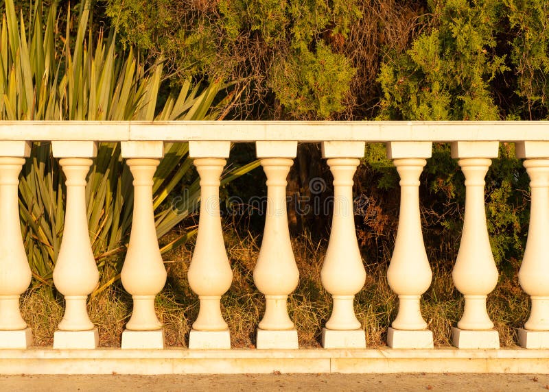 Balusters at sunset. Trees stock image. Image of background - 184518505