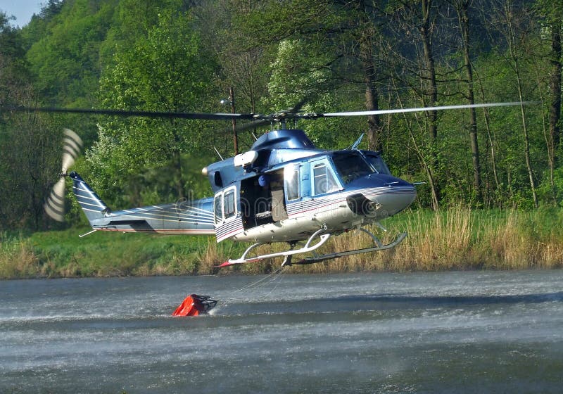 Bambi bucket stock photo. Image of copter, trees, drop - 10106914