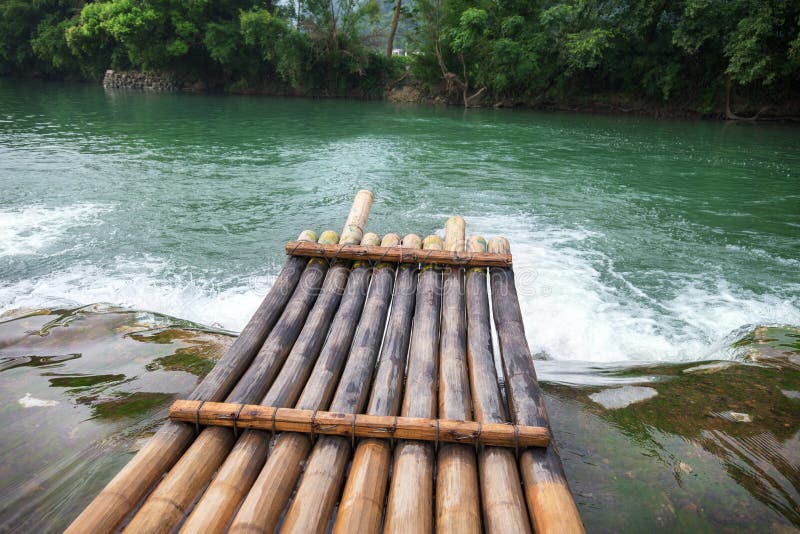 Bamboo boat stock image. Image of adventure, yangshuo - 100479123