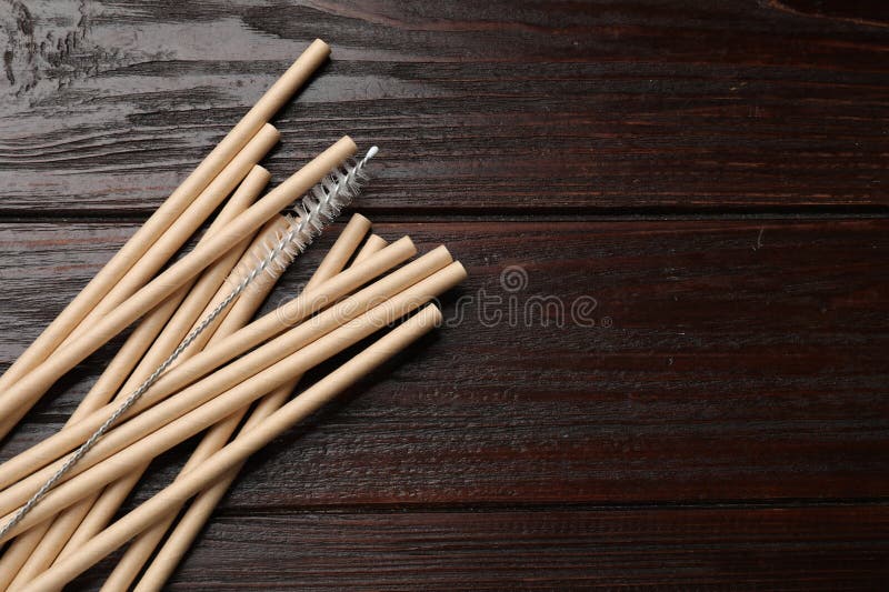 Bamboo Drinking Straws on Wooden Table, Top View. Space for Text Stock ...