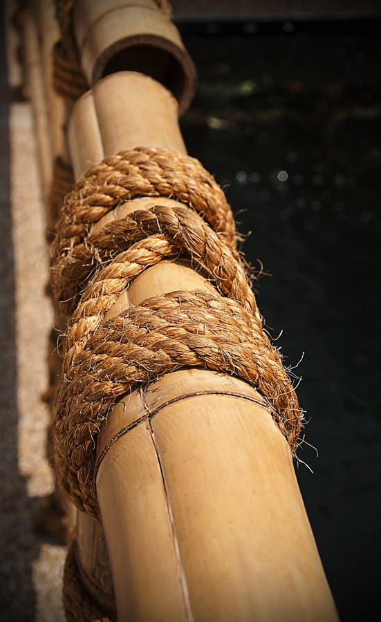 Bamboo Fence with Stick Rope in Sunny Day. Focused on Front Rope Stock ...