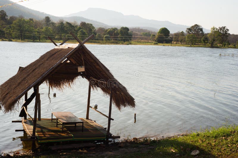 Bamboo hut lake side view stock image. Image of side - 89685145