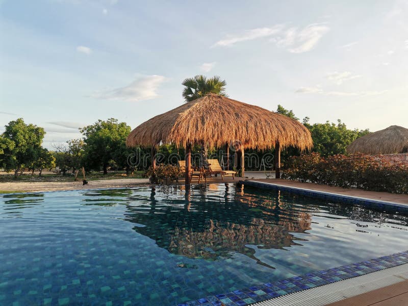 Bamboo hut at pool stock image. Image of shore, edge - 262243293