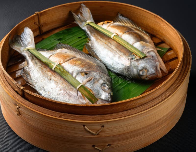 A Bamboo Leaf Steamer Filled with Freshly Cooked Fish Stock ...