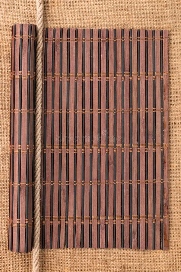 Bamboo Mat Rolled into a Scroll and Rope, Lying on a Sacking Stock ...