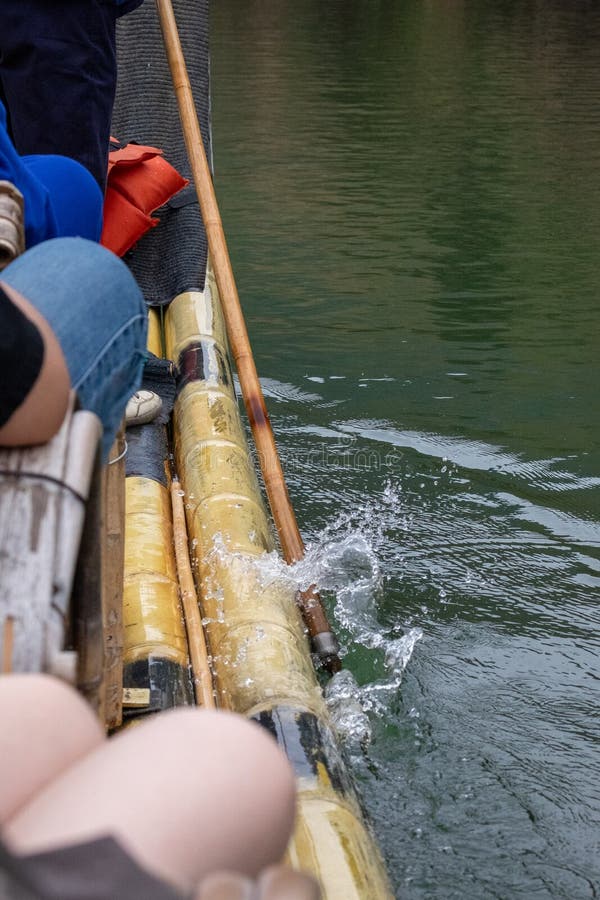 Bamboo raft in moving stock photo. Image of rowing, kayak - 260174422