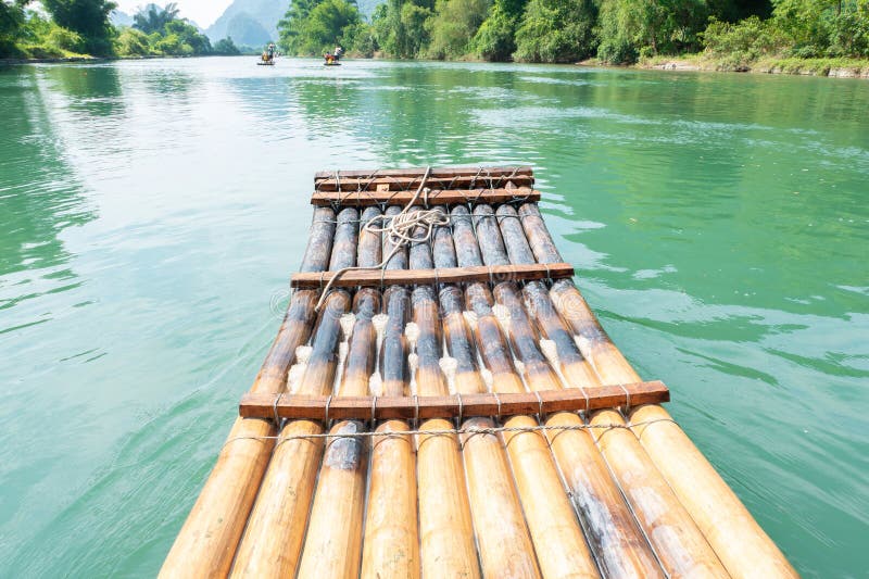 A Bamboo Raft Paddling on the River Stock Image - Image of design ...