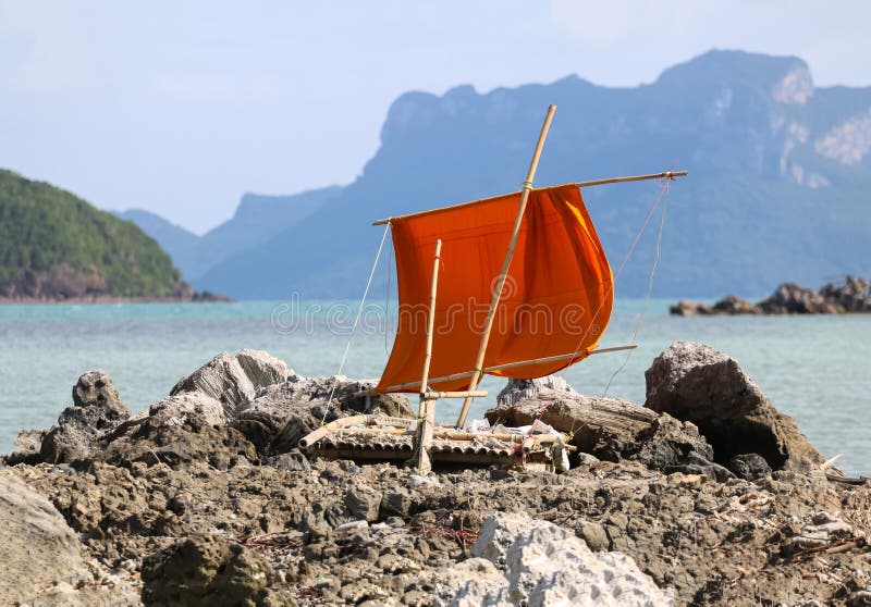 Bamboo Raft with Sails Stranded on Rocks by the Sea in Thailand Stock ...