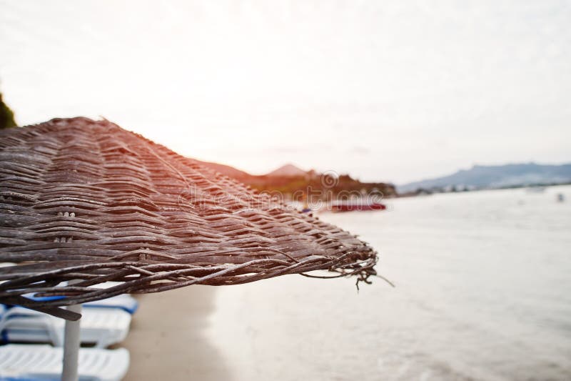 Bamboo and Reed Straw Beach Umbrellas Stock Photo - Image of seascape ...