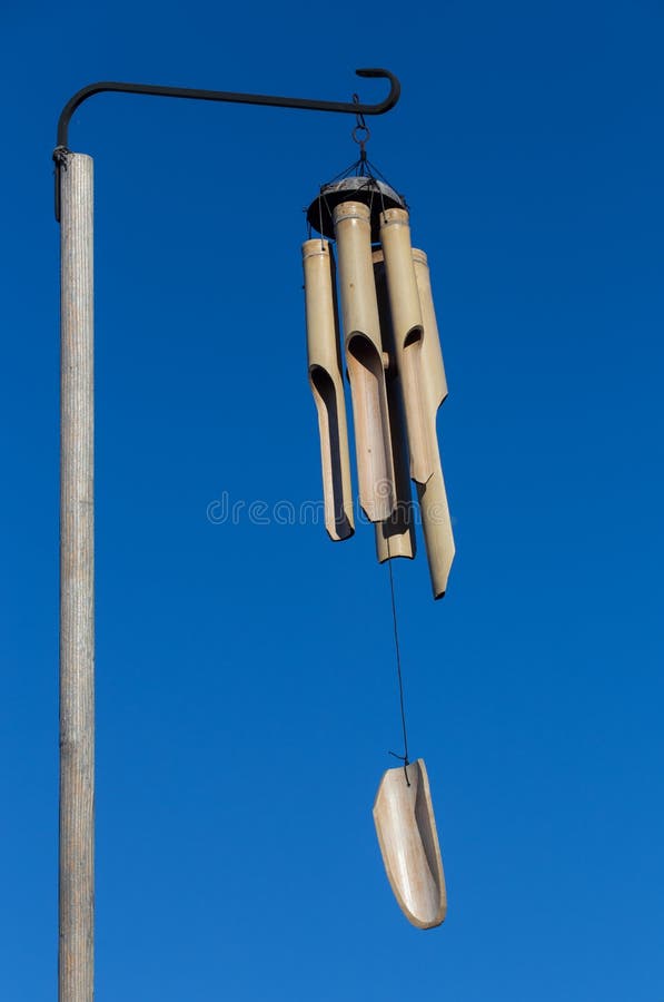 Bamboo Wind Chimes Against a Blue Sky Stock Image - Image of vertical ...