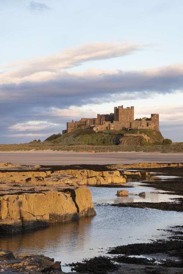 Bamburgh Castle from Harkness Rocks Sunset Vert Stock Image - Image of ...