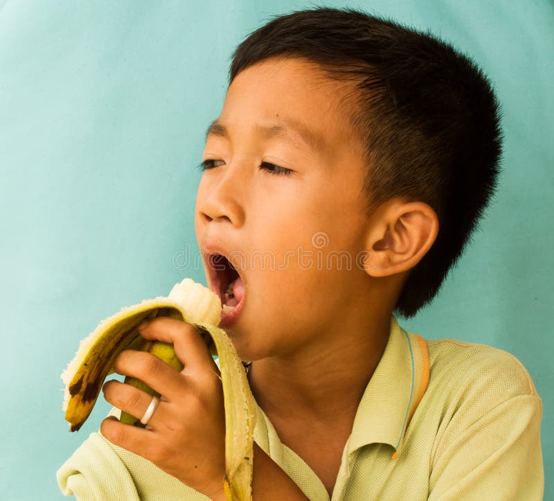 177 Asian Child Eating Banana Stock Photos - Free & Royalty-Free Stock ...