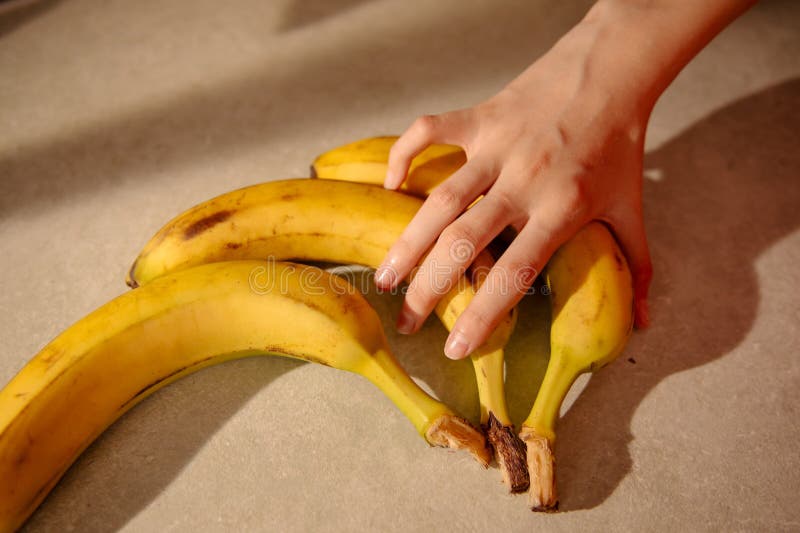Banana in Female Hand stock photo. Image of food, lifestyle - 292279136