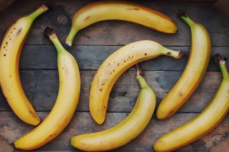 Ripe Yellow Bananas in Wicker Basket, Apples in Mug and Honey on Wooden ...