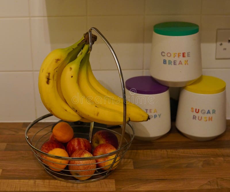 Banana Holder with a Peach Basket and Ceramic Jars in the Kitchen Stock ...
