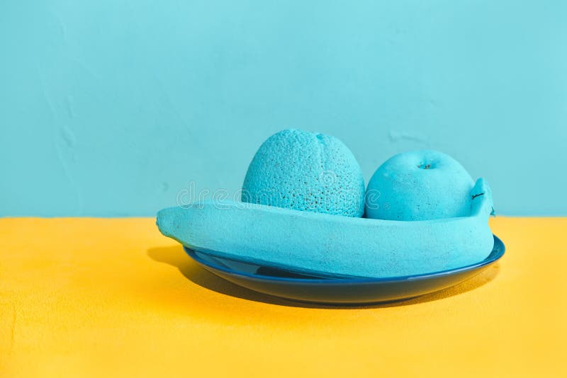 Banana Orange Apple Cyan Colored on a Plate. Creative Design Concept ...
