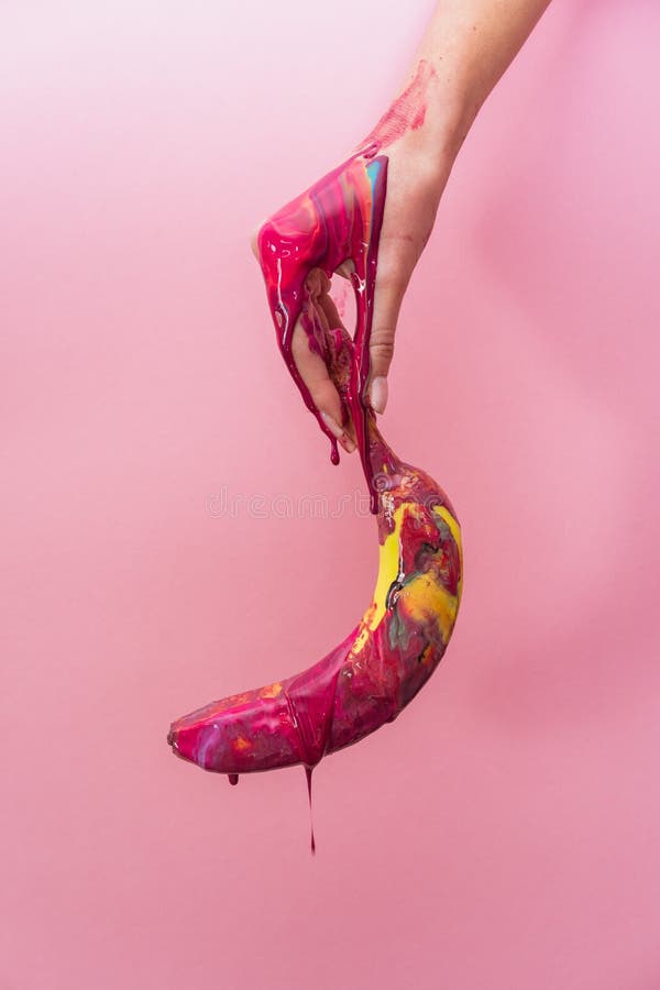 Banana in Pink Paint in Hand. the Paint Flows Down the Banana. Creative ...