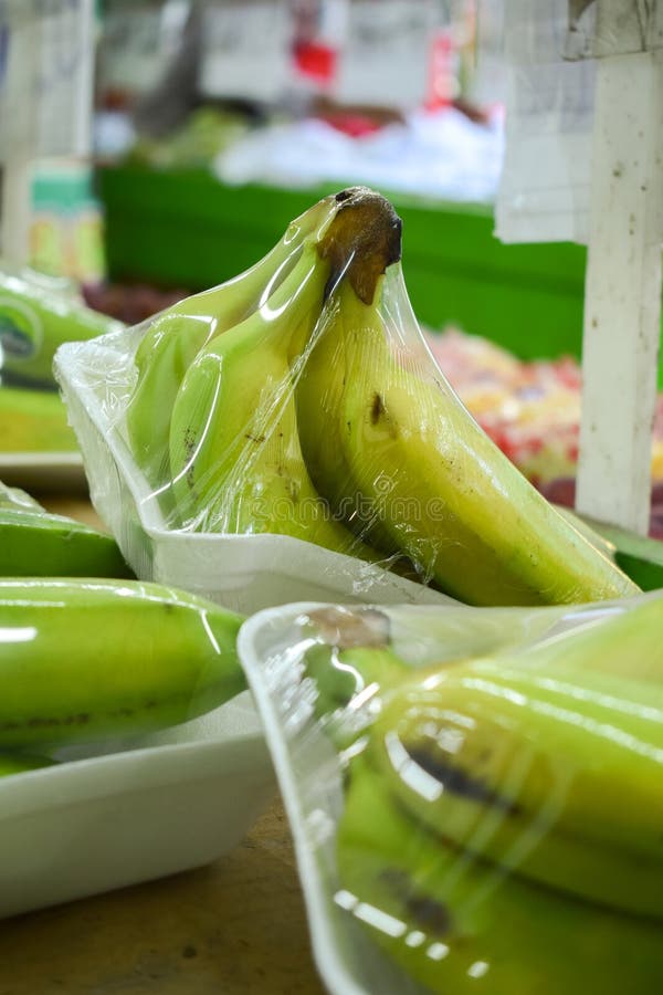Banana in Plastic Wrap in Supermarket Stock Image - Image of plastic ...