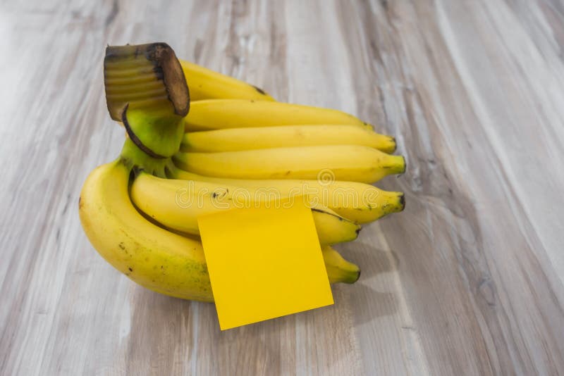 Banana with Sticky Note on Wood Table . Stock Image - Image of fresh ...