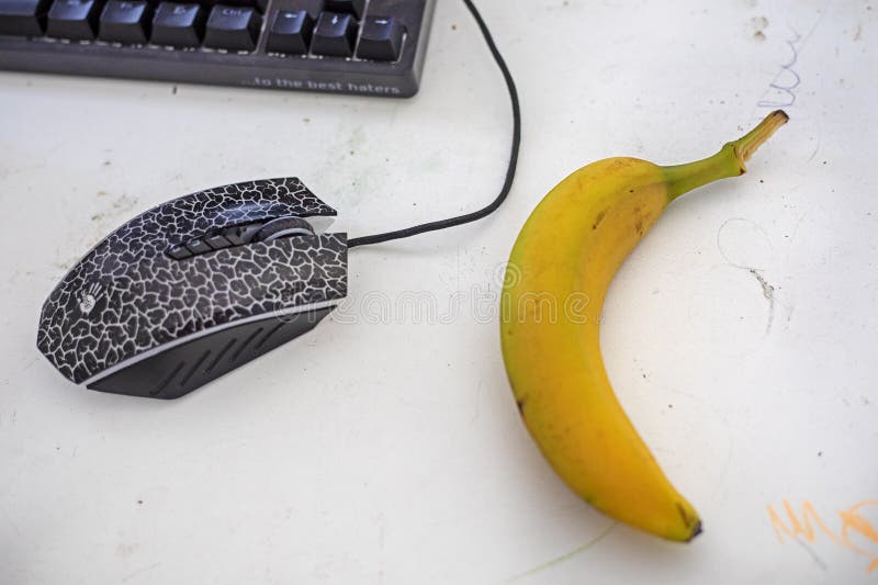 Banana on the Table Near the Computer with a Computer Mouse. Stock ...