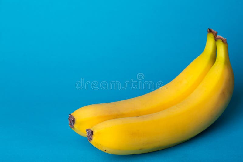 Bananas on a Blue Background Stock Image - Image of healthy, fresh ...