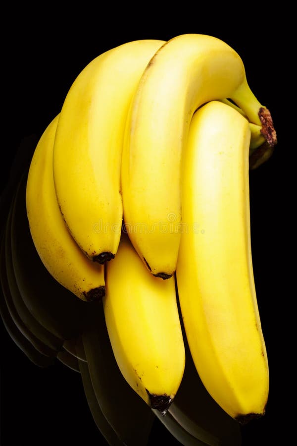 Bananas Brunch on Glass Table. Isolated on Black. Stock Image - Image ...