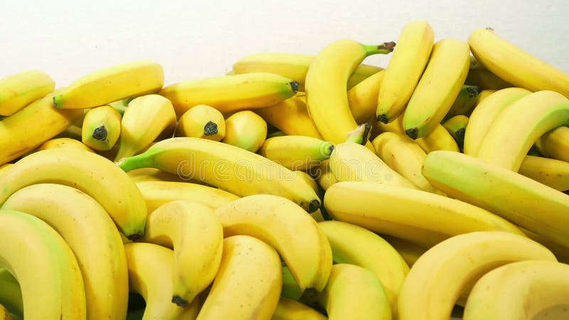 Bananas Build Up into Large Pile Stock Video - Video of breakfast ...