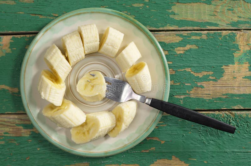 Bananas in plate stock image. Image of ripe, sliced, plate - 97894575