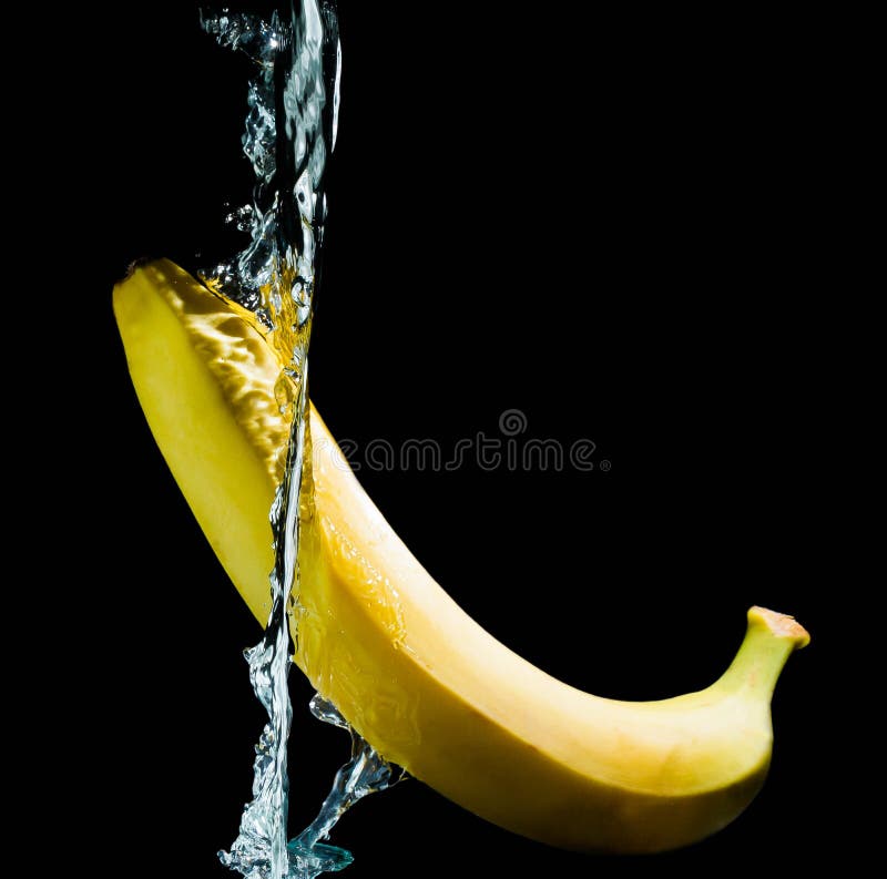 Bananas Splash in Water To Movement Over Black Background Stock Photo ...