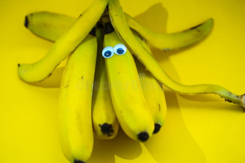 Bananas on a String, Yellow Background, Funny Bananas with Eyes ...