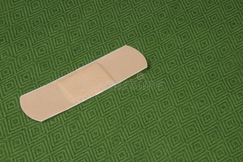 Band Aid on Green stock photo. Image of injury, bandage - 10959116
