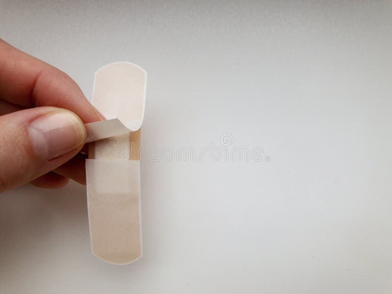 Band-aid in Hand on a White Background Stock Image - Image of accident ...