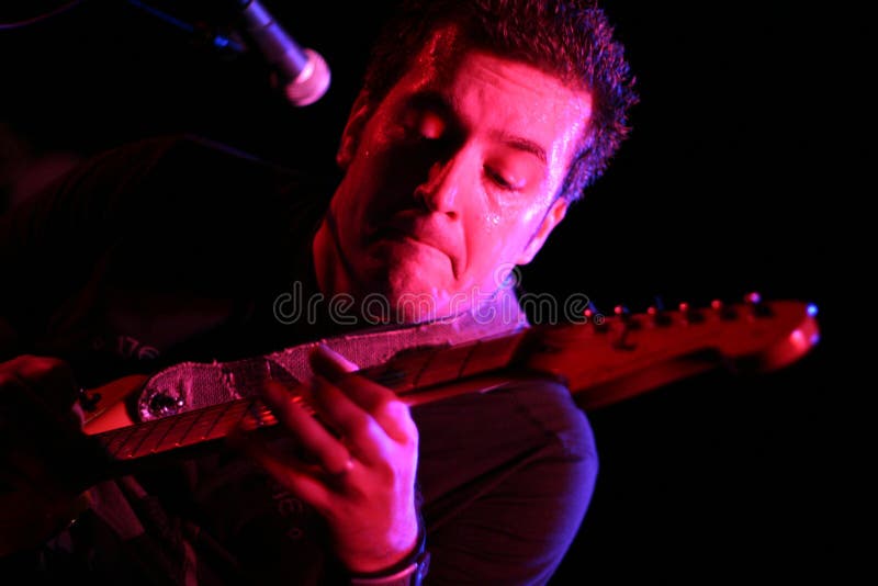 Band Member Playing Guitar Solo on Stage, Close-up Stock Photo - Image ...