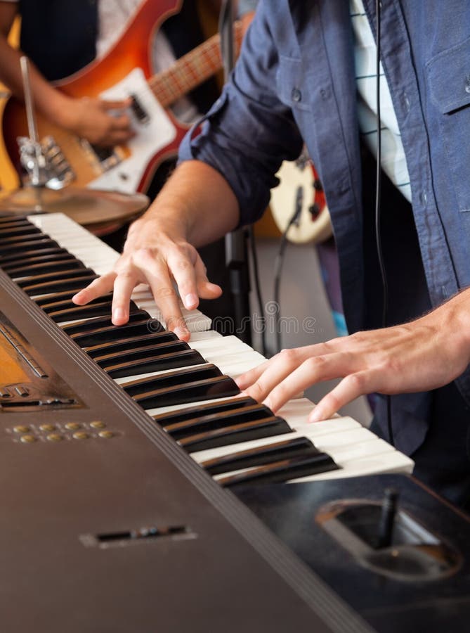 Band Member Playing Piano In Recording Studio Stock Photo - Image of ...