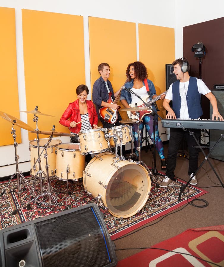 Band Performing Together in Recording Studio Stock Photo - Image of ...