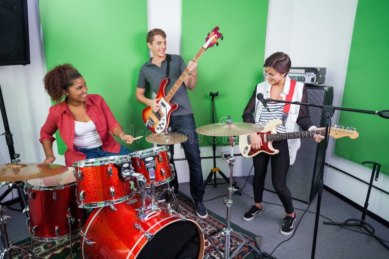 Band Members Performing in Recording Studio Stock Image - Image of ...