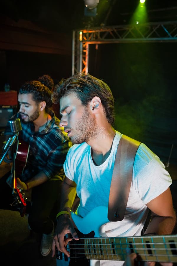 Band performing on stage stock image. Image of entertainment - 93235899