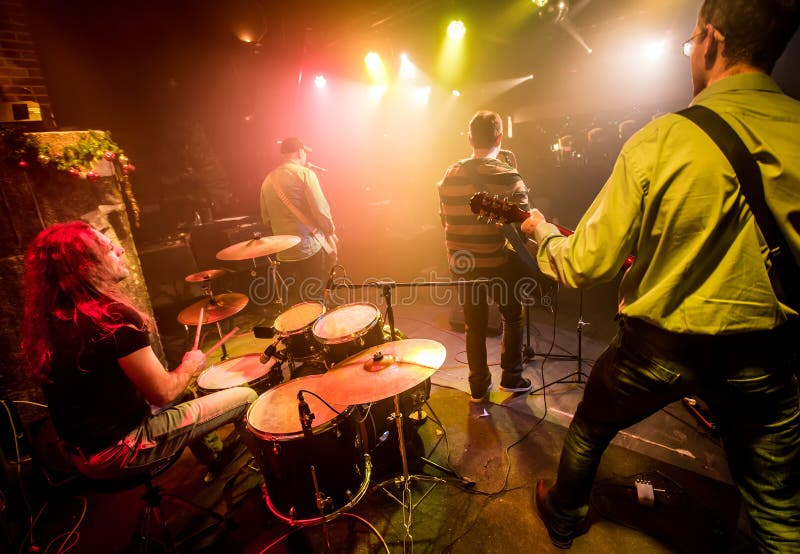 Band performs on stage stock image. Image of club, guitar - 37897899