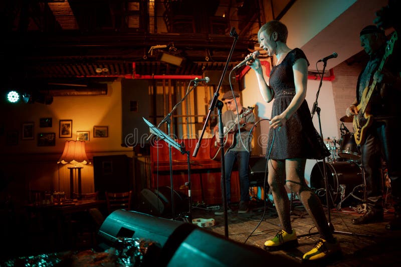 Band Performs on Stage, Rock Music Concert in a Nightclub Stock Image ...