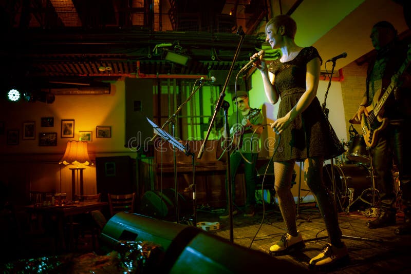 Band Performs on Stage, Rock Music Concert in a Nightclub Stock Image ...