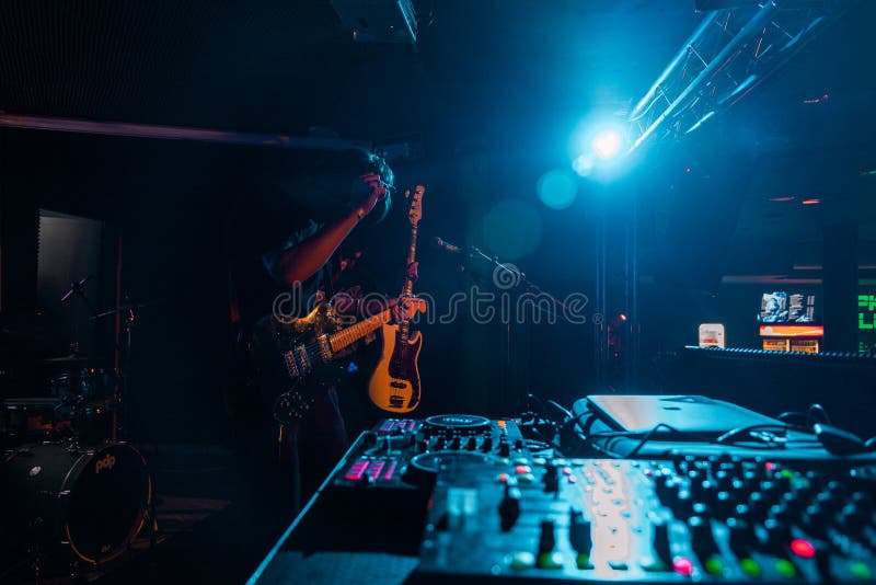 Band Playing on Guitars and Drums during a Concert in a Club Stock ...