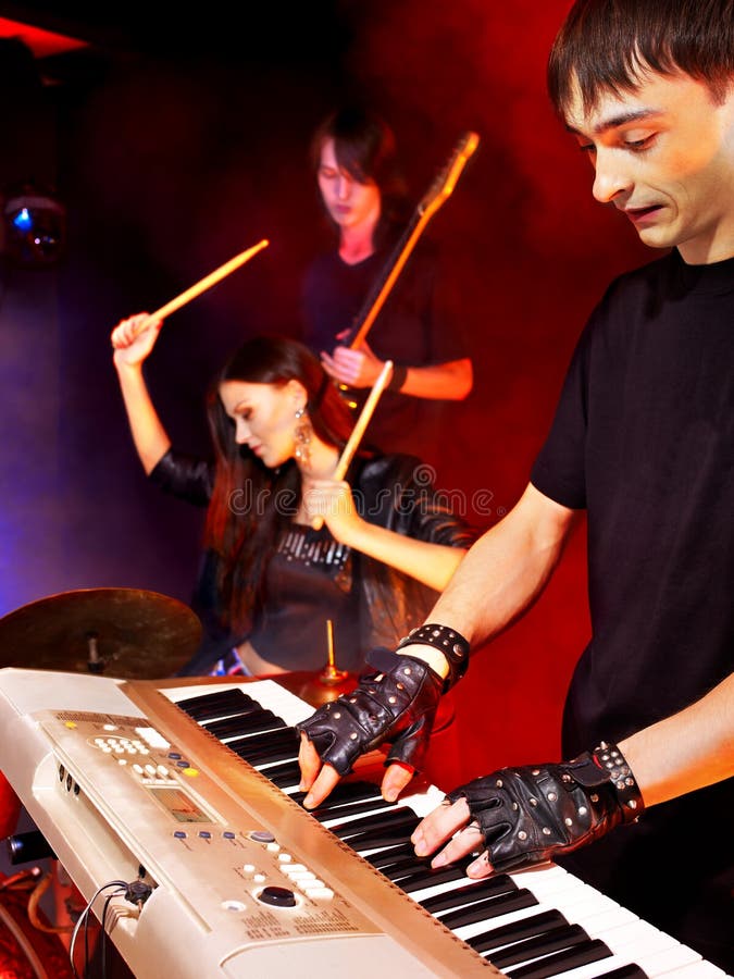 Band Playing Musical Instrument. Stock Photo - Image of night, lighting ...