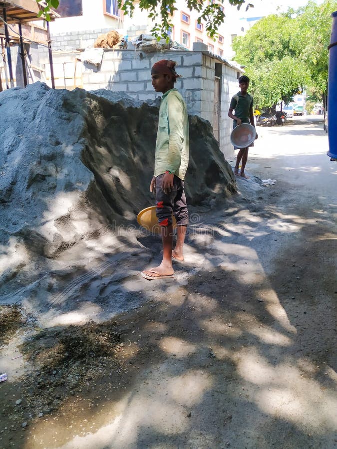 Workers or Labourers Working in a Man Made Sand for Construction of ...