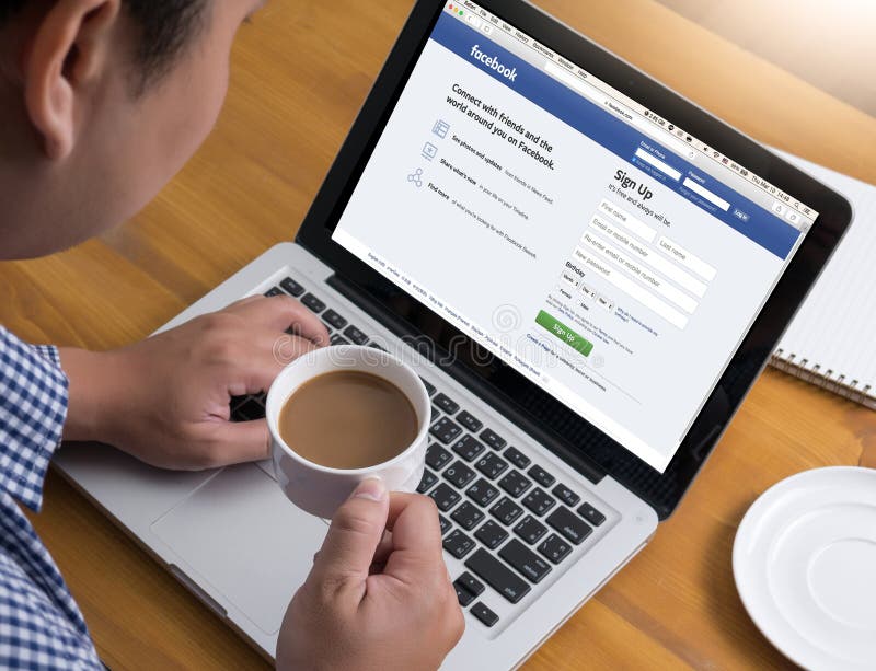 Bangkok, Thailand - Mar 10, 2015: Man on a Computer Browsing Facebook ...